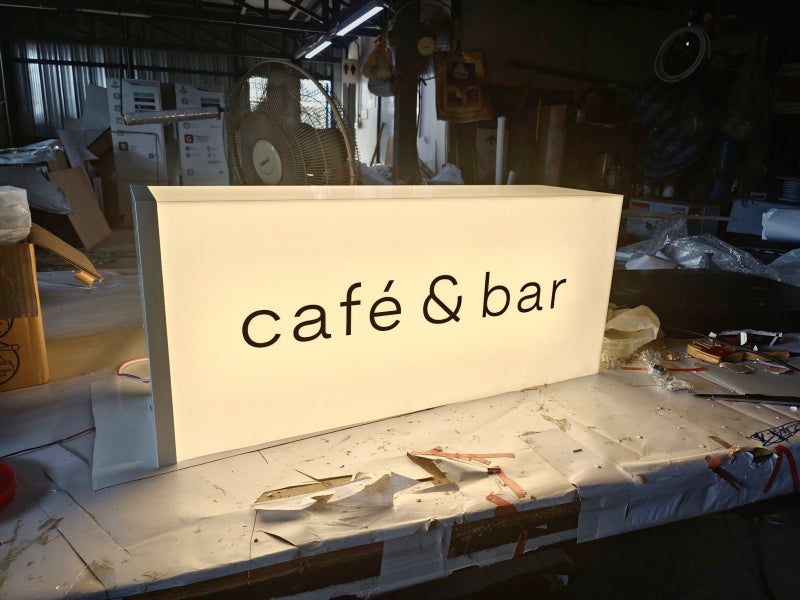 Acrylic light box, lights around the sign, attached from the wall