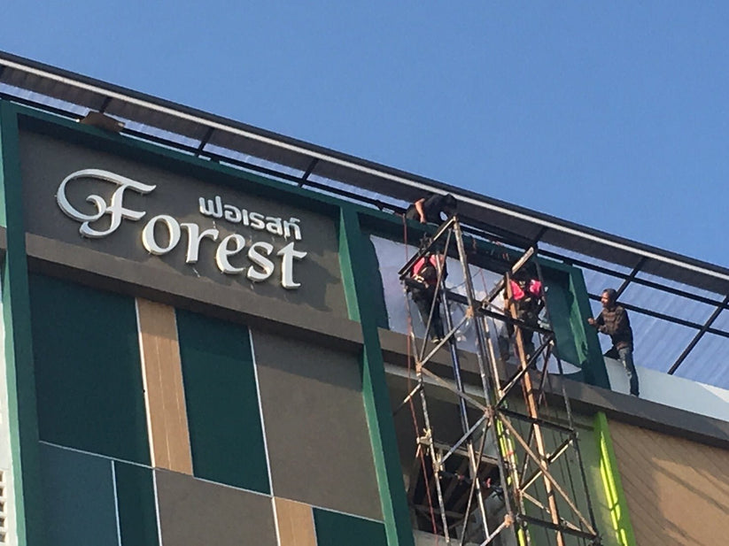 Install the sign by setting up scaffolding. performed with skill