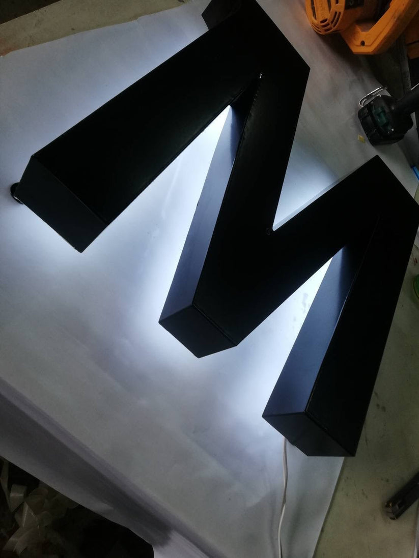 Backlit letters Covered on the back of acrylic to prevent reflection o